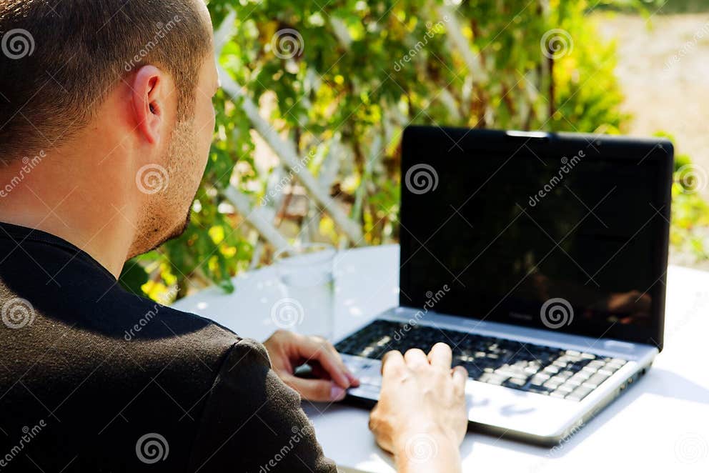 Man Working with Laptop Outside Stock Photo - Image of looking, laptop ...