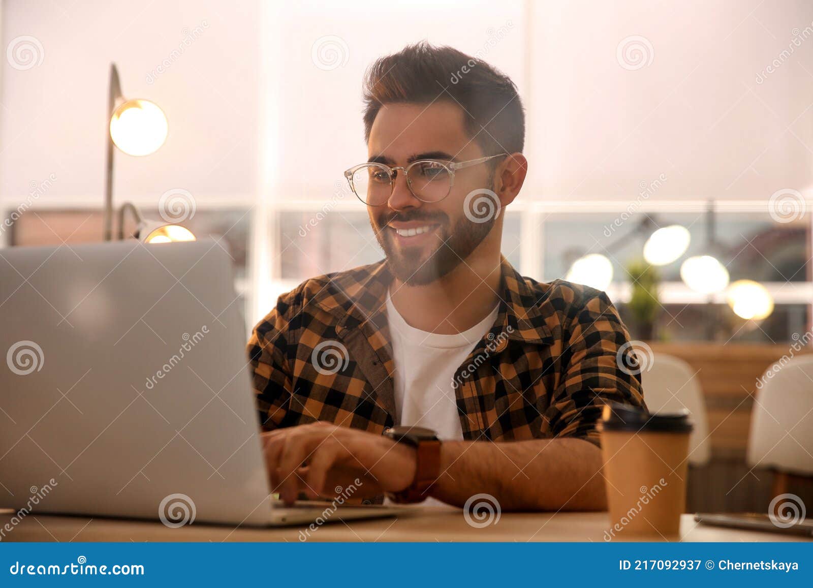 Man Working with Laptop at Table in Cafe Stock Image - Image of laptop ...