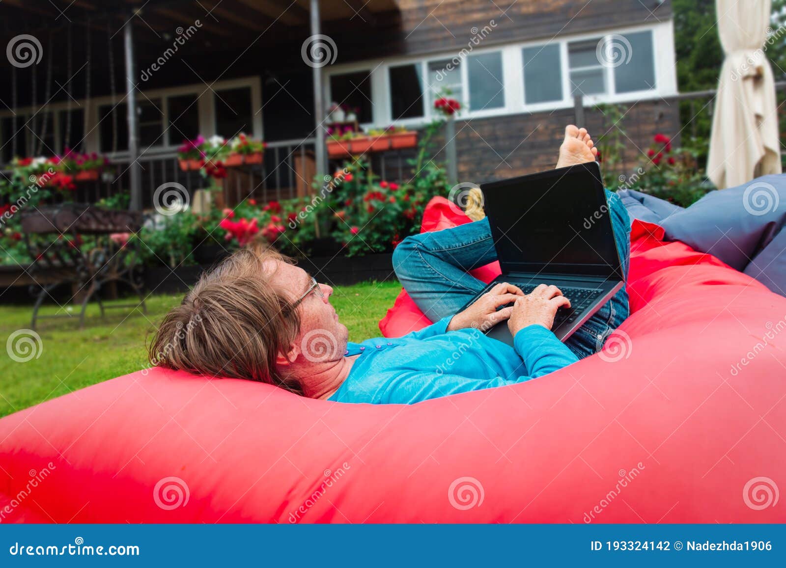 Man Working on Laptop on Terrace, Remote Work in the Country Stock ...