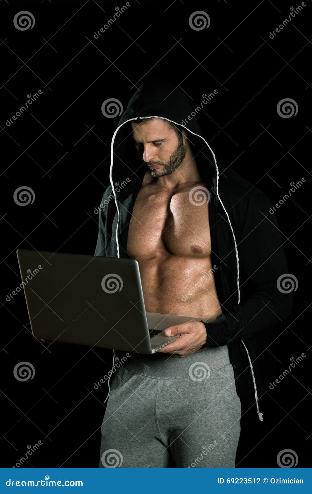 Man working at laptop stock photo. Image of attractive - 69223512