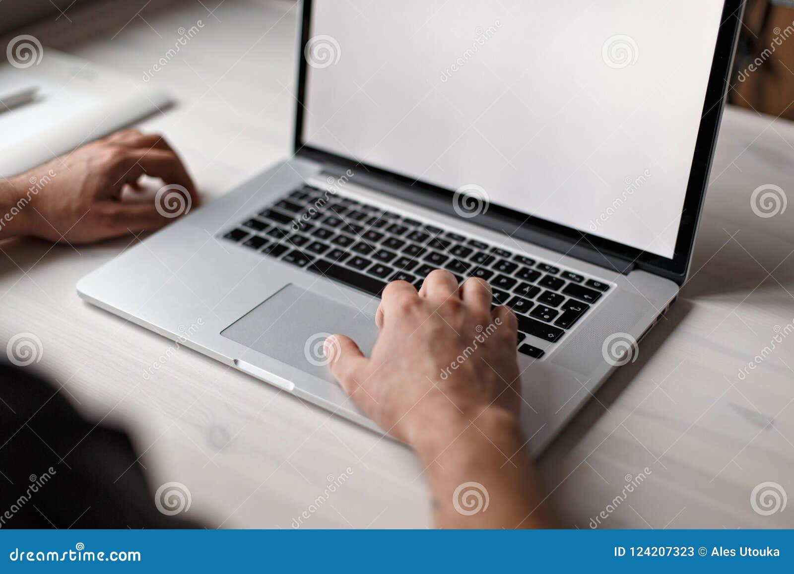 Man Working on a Laptop on a White Wooden Table. Stock Image - Image of ...