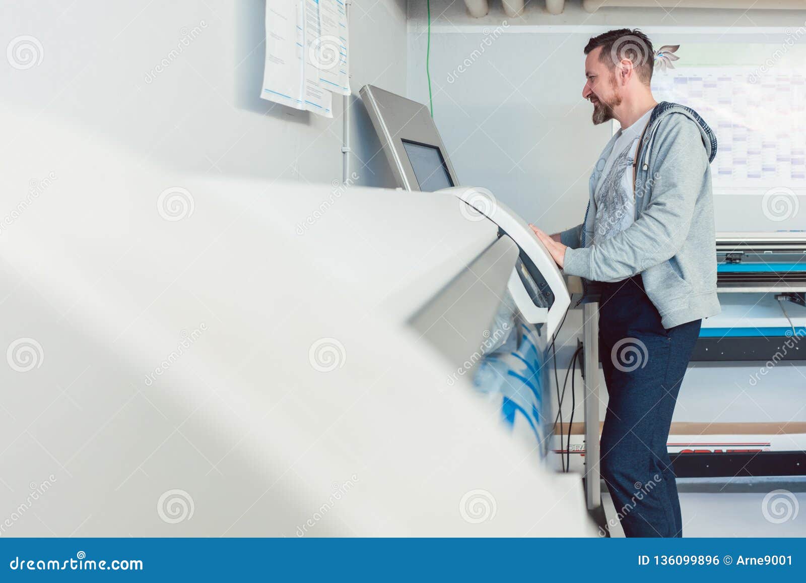 Man Working on Large Format Printer in Advertising Agency Stock Photo ...