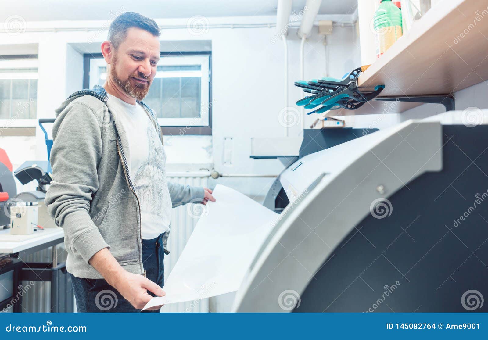 Man Working on Large Format Printer in Advertising Material Agency ...