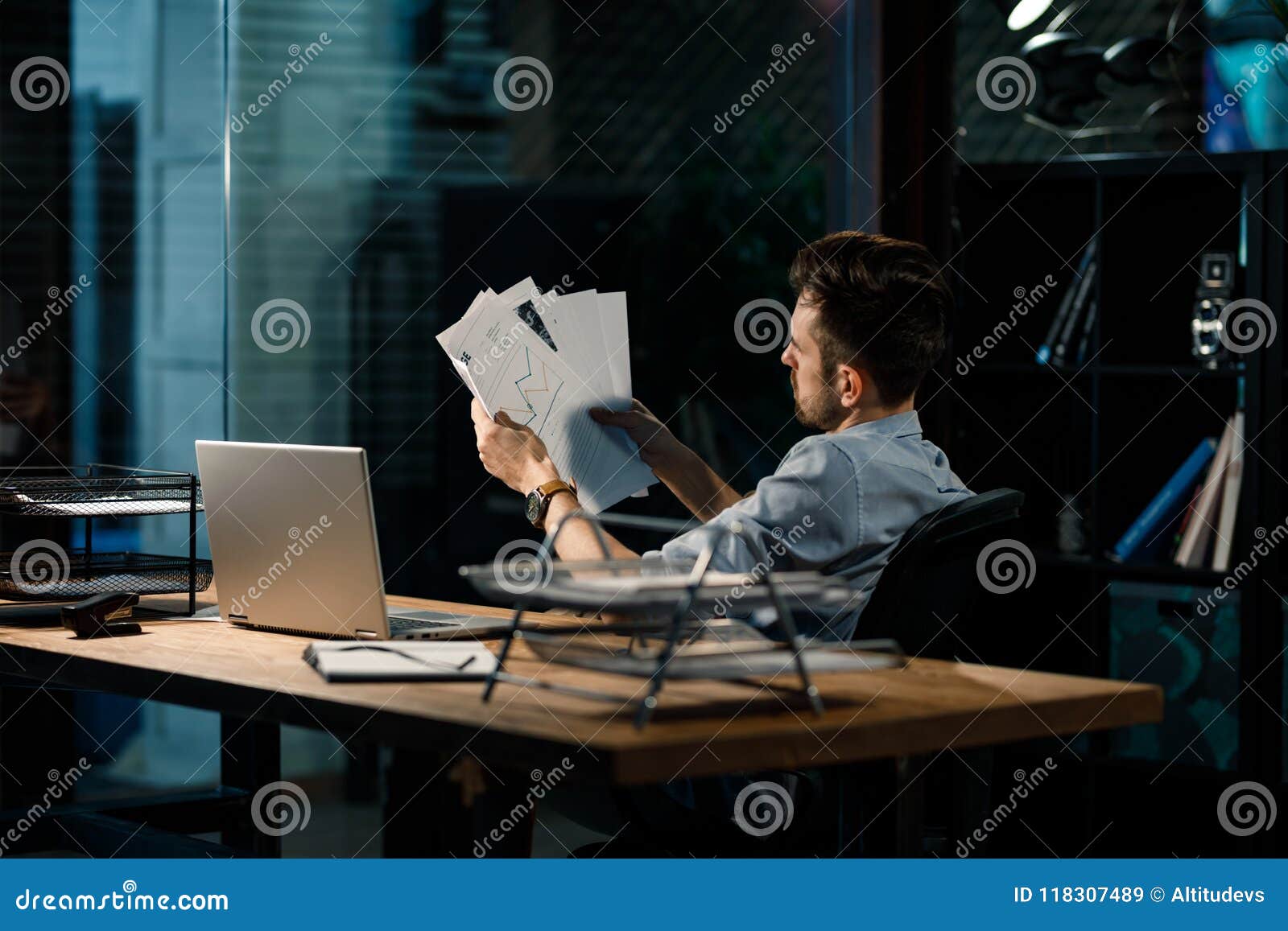 Casual Man Reading Papers in Office Stock Image - Image of overload ...