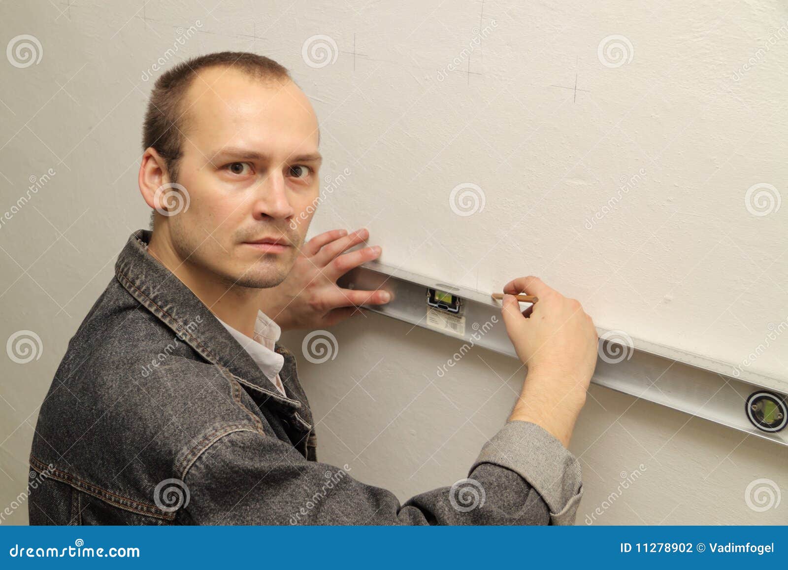 Man working level. stock photo. Image of line, improvement - 11278902