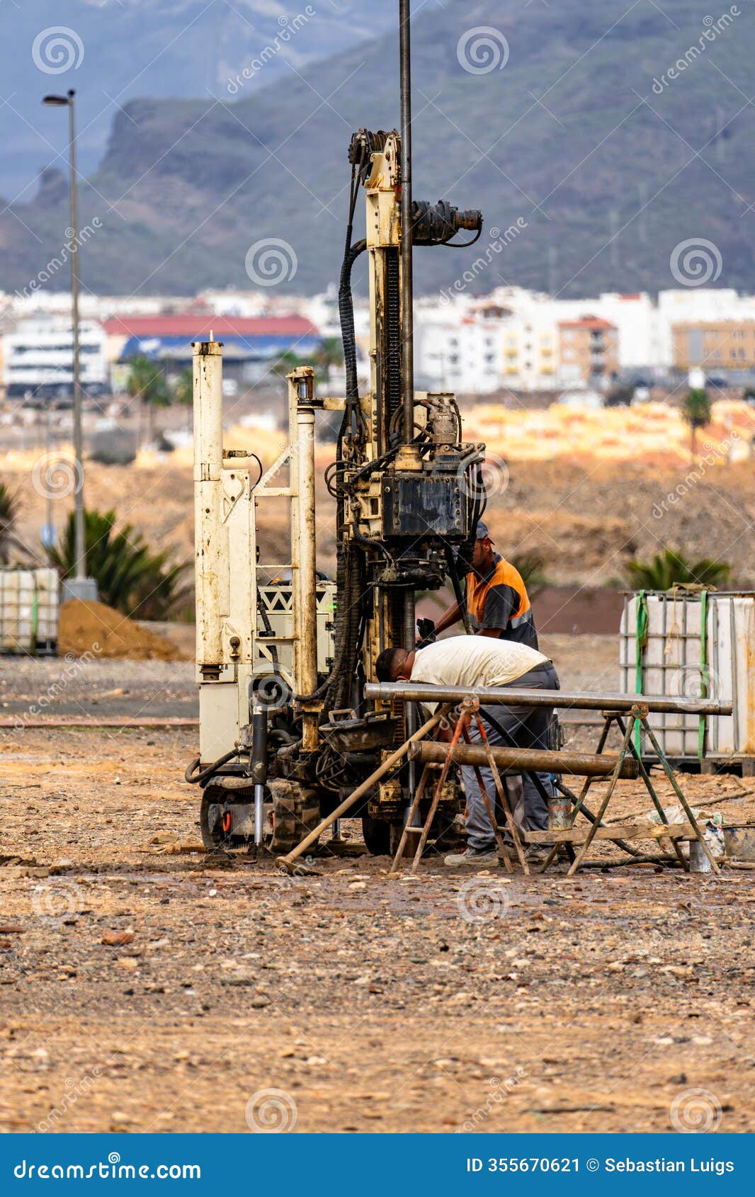 A Man is Working on a Machine in a Field Stock Image - Image of shirt ...