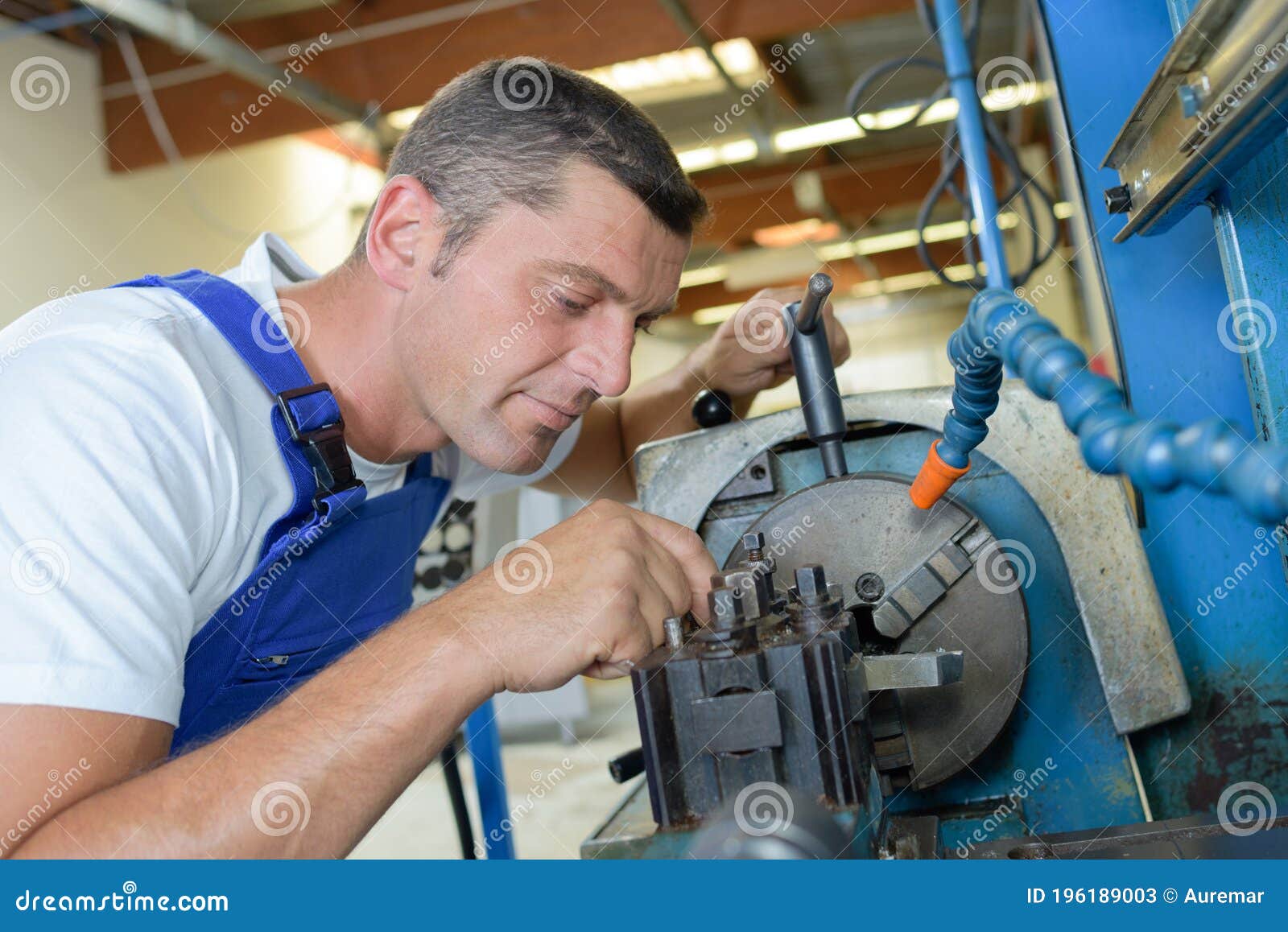 Man Working on Machine Modification Stock Image - Image of serious ...
