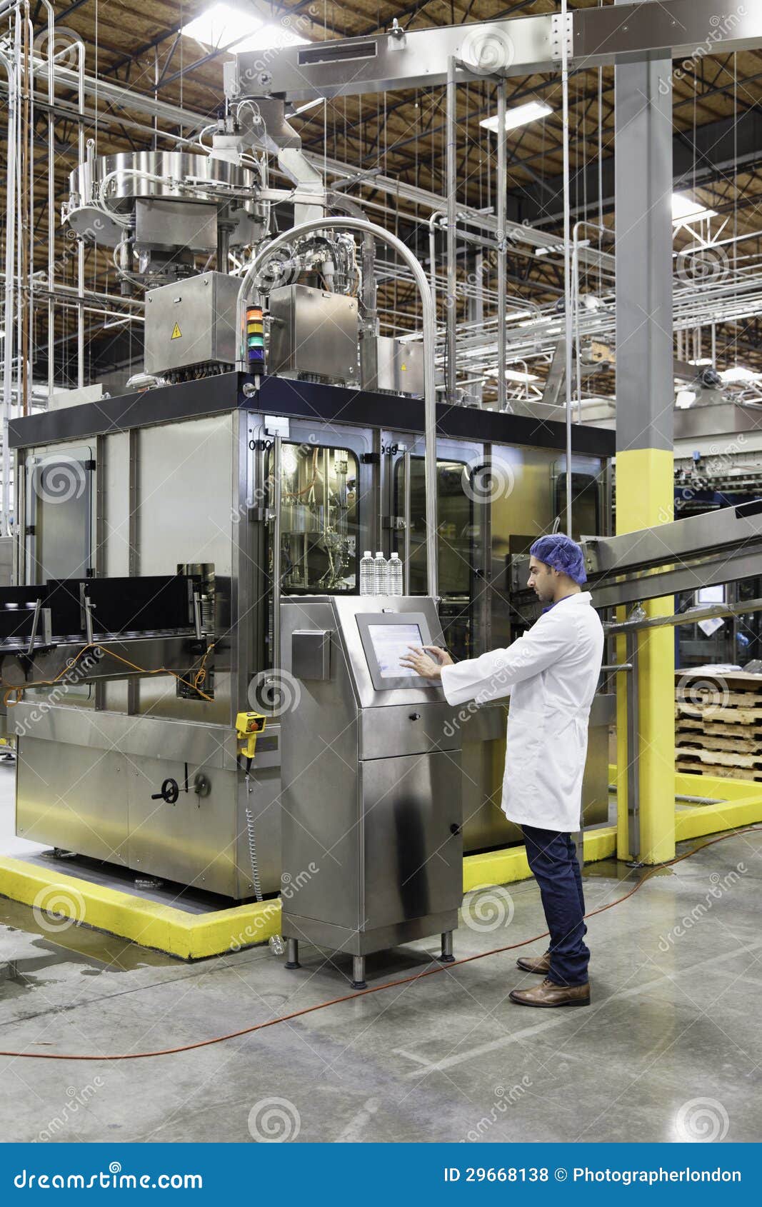 Man Working on Machinery in Bottling Industry Stock Photo - Image of ...