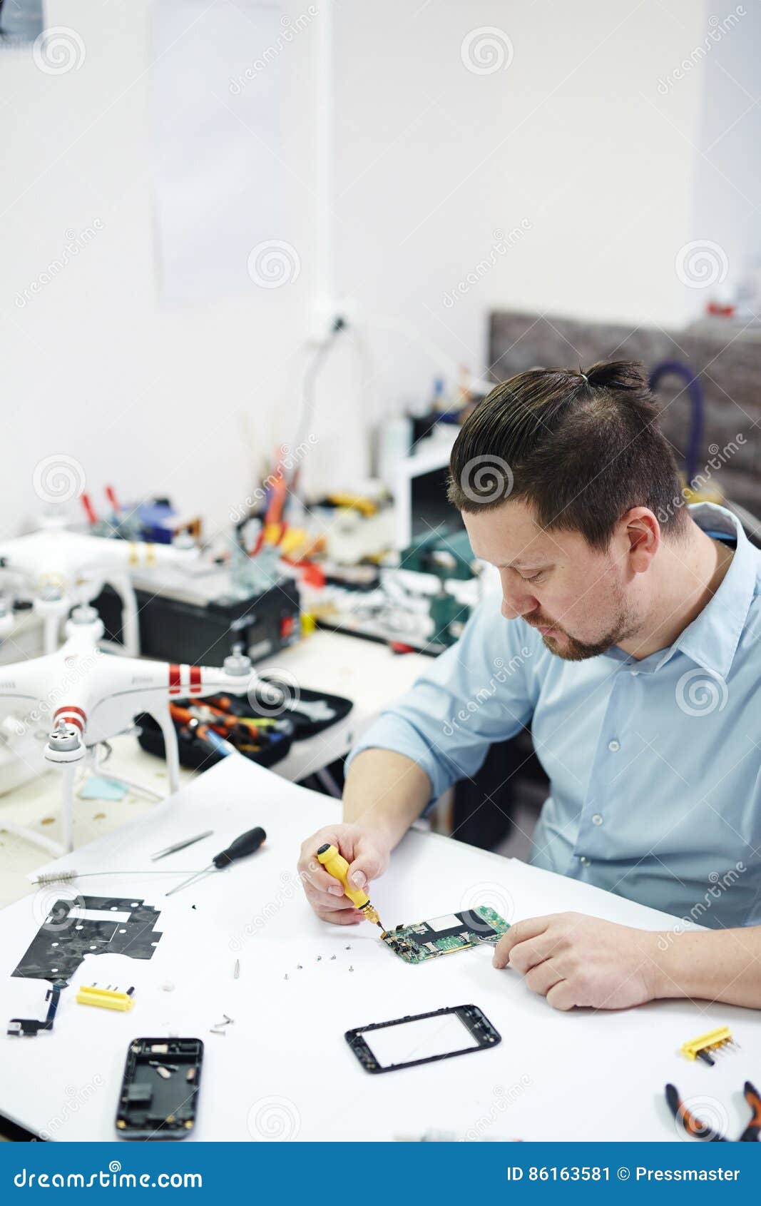 Man Working in Maintenance Shop Stock Image - Image of digital, gadget ...