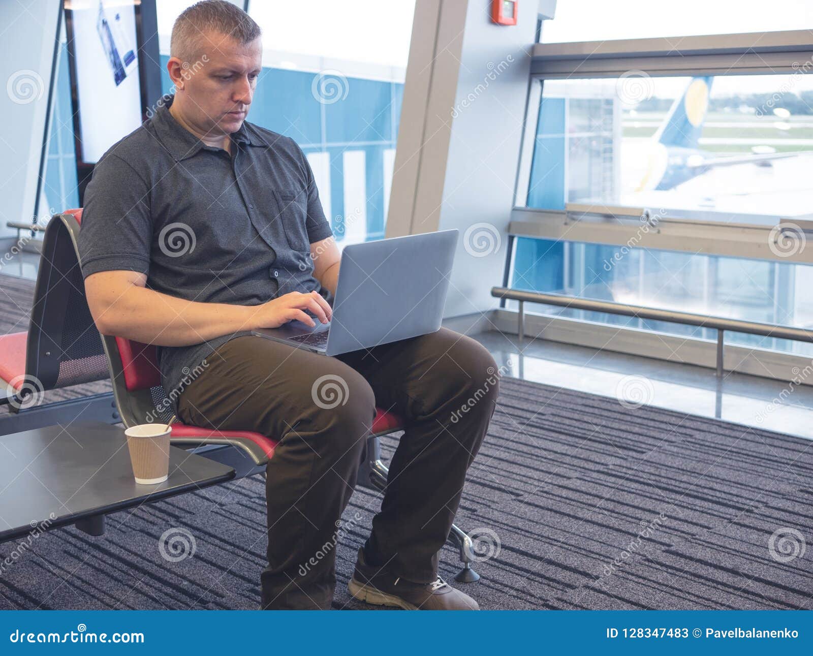 Man Working on Mobile Computer at Airport Stock Image - Image of casual ...
