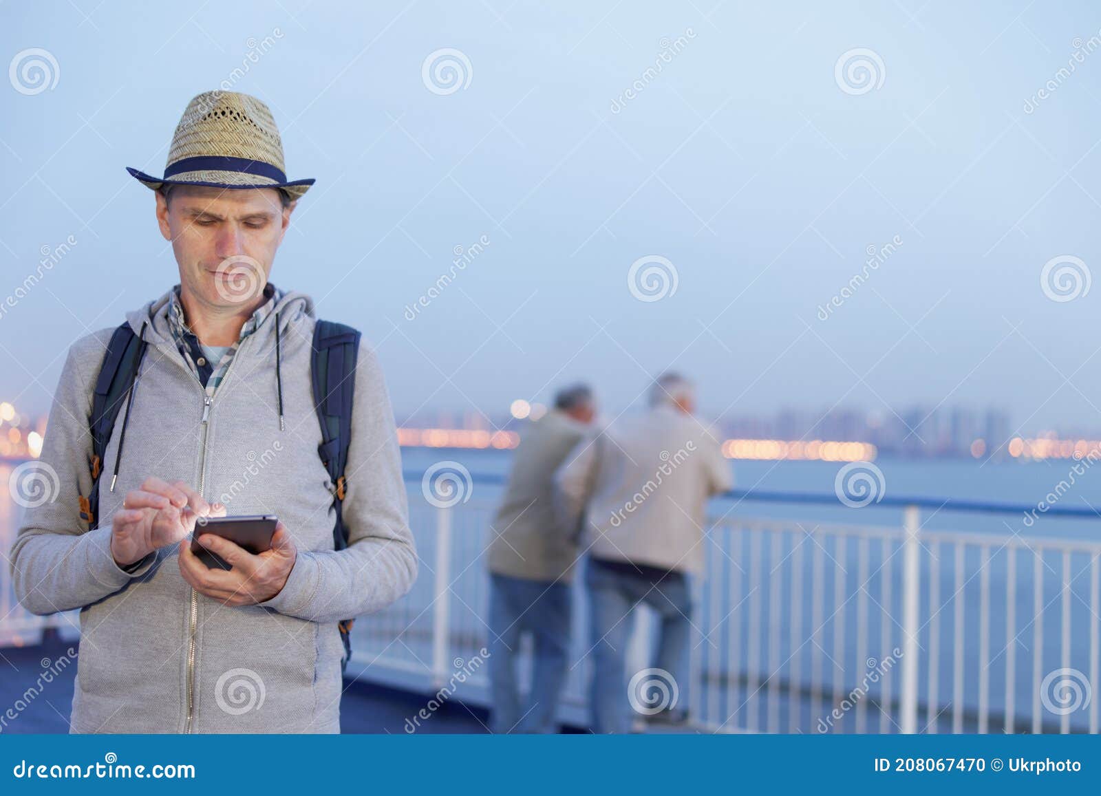 Man Working with Mobile Phone on the Deck of Cruise Ship Stock Photo ...
