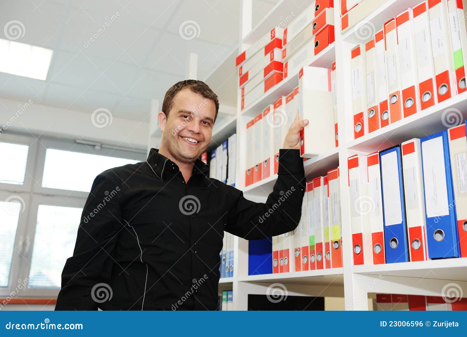 Man Working at Office Putting Folders Together Stock Photo - Image of ...