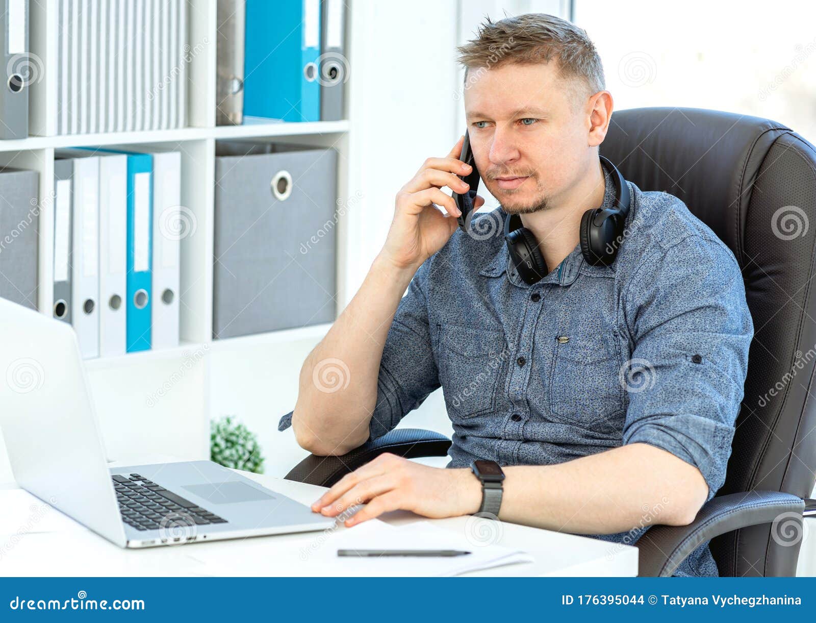 Man working in office stock photo. Image of laptop, covid19 - 176395044