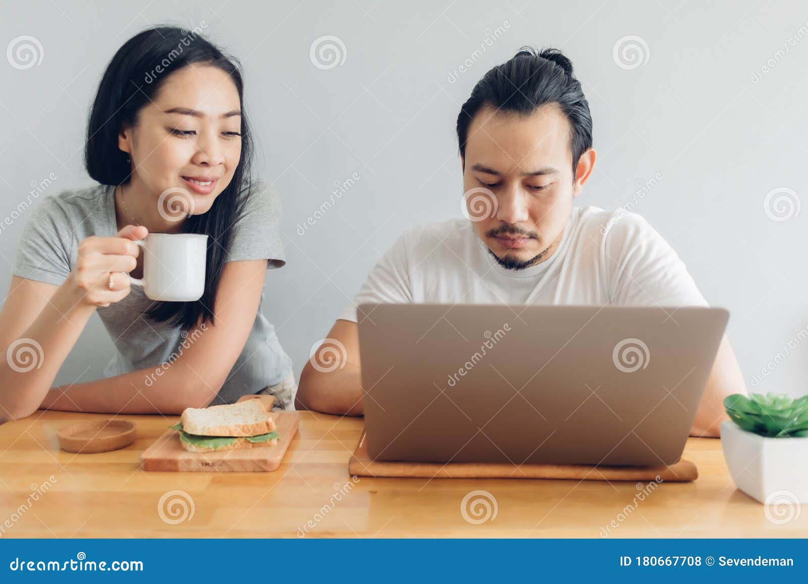 Man is Working Online with His Wife Support in Concept of Work from ...