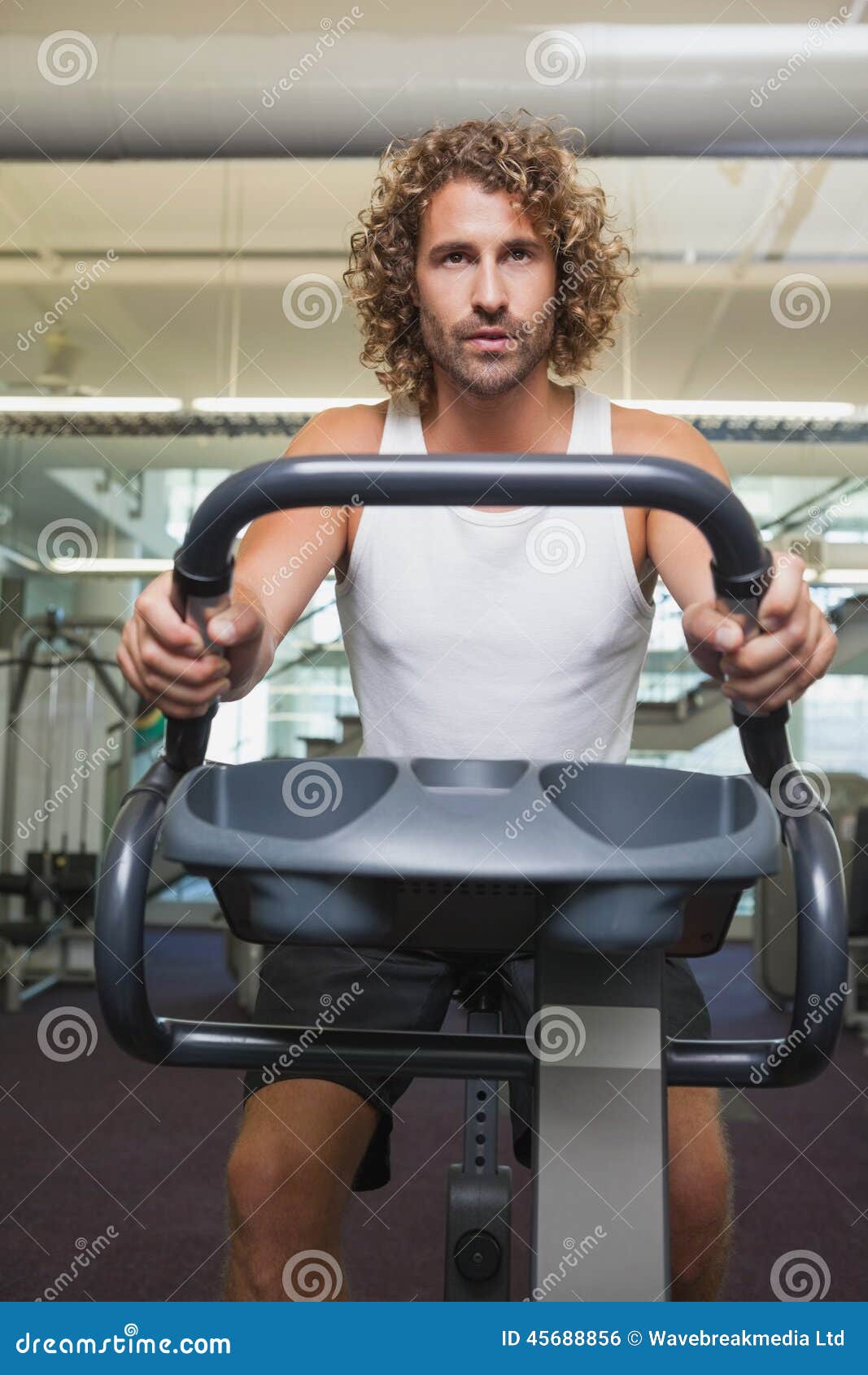 Man Working Out on Exercise Bike at Gym Stock Photo - Image of machine ...