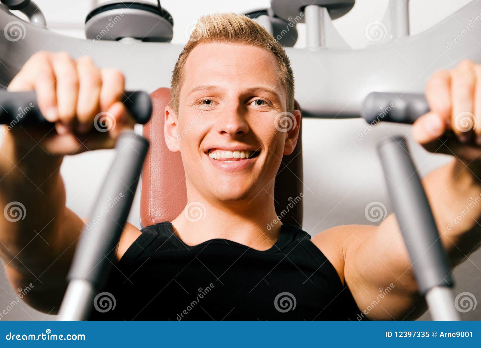 Man working out in gym stock image. Image of muscles - 12397335