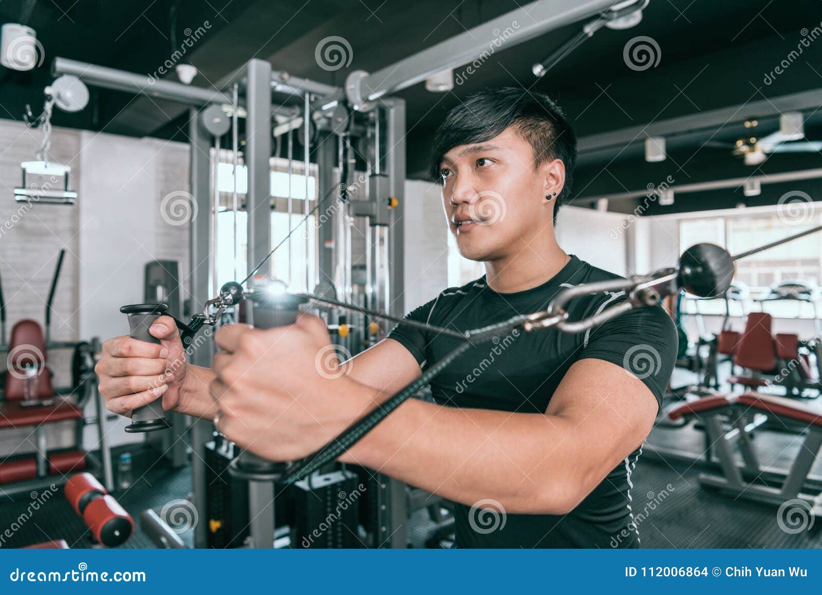 Man Doing Cable Standing Fly on Tower Stock Photo - Image of ...