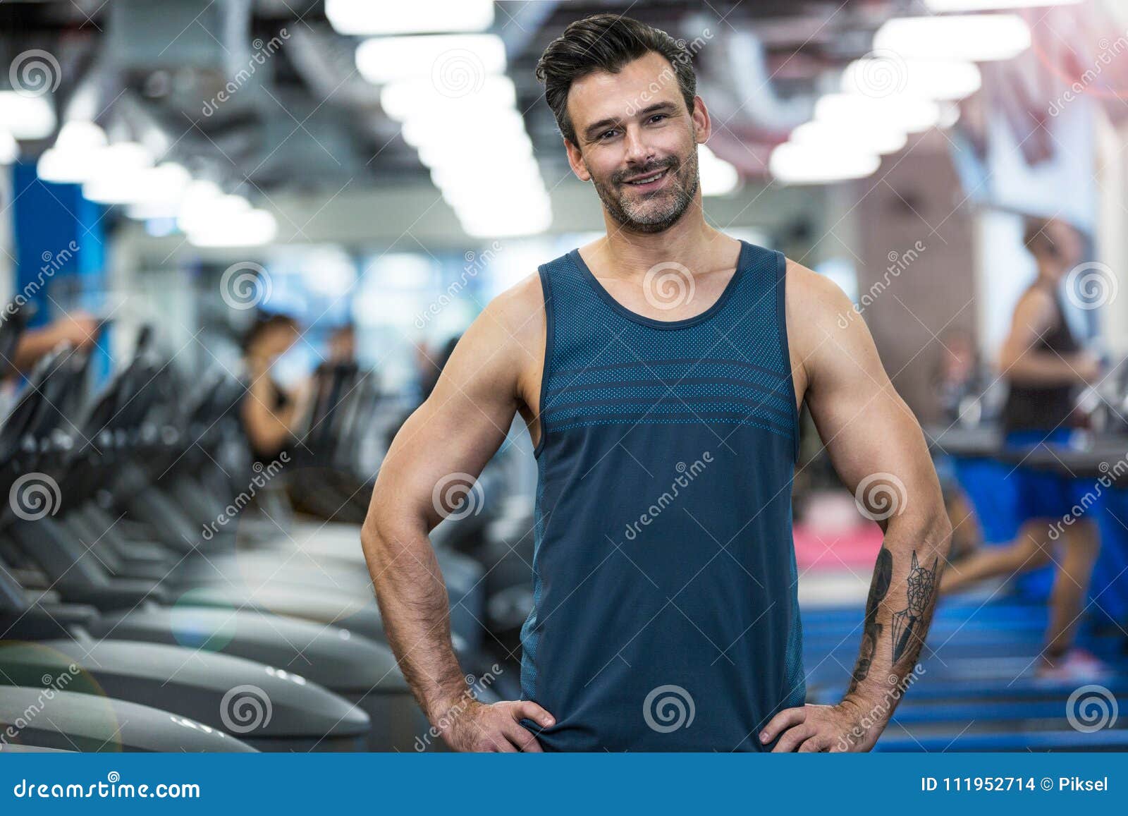 Man working out in gym stock photo. Image of adult, club - 111952714