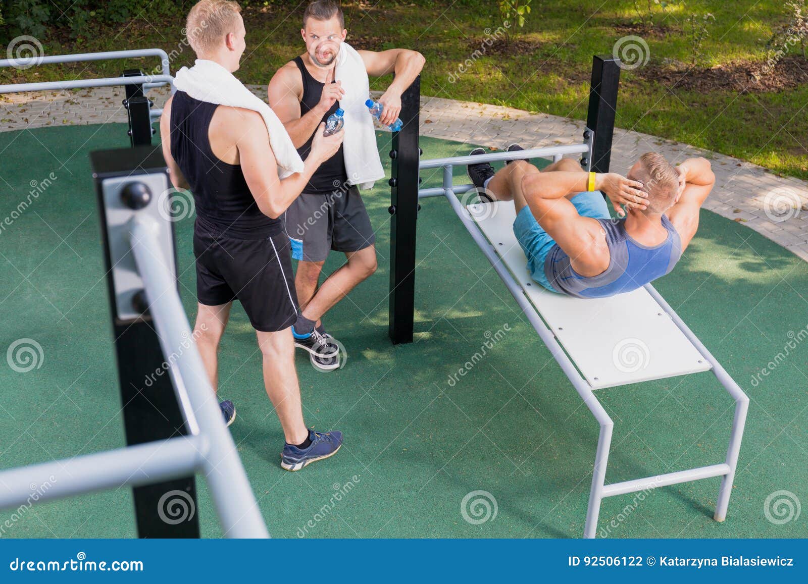 Man Working Out and His Friends Resting Stock Photo - Image of trainer ...