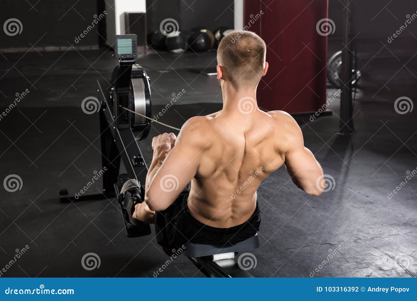 Man Working Out on Row Machine Stock Photo - Image of indoors, person ...