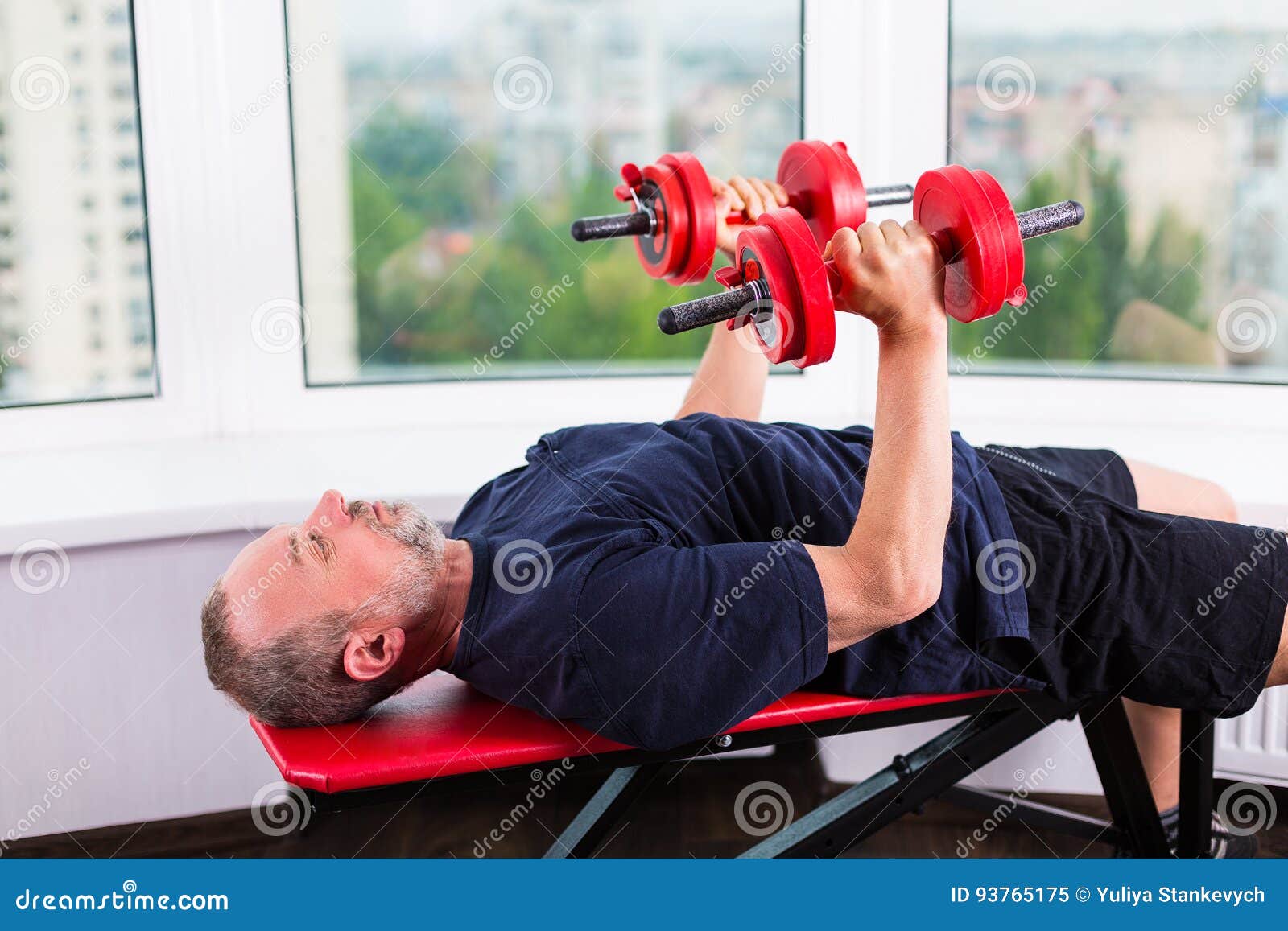 Man working out stock image. Image of home, beard, shorts - 93765175