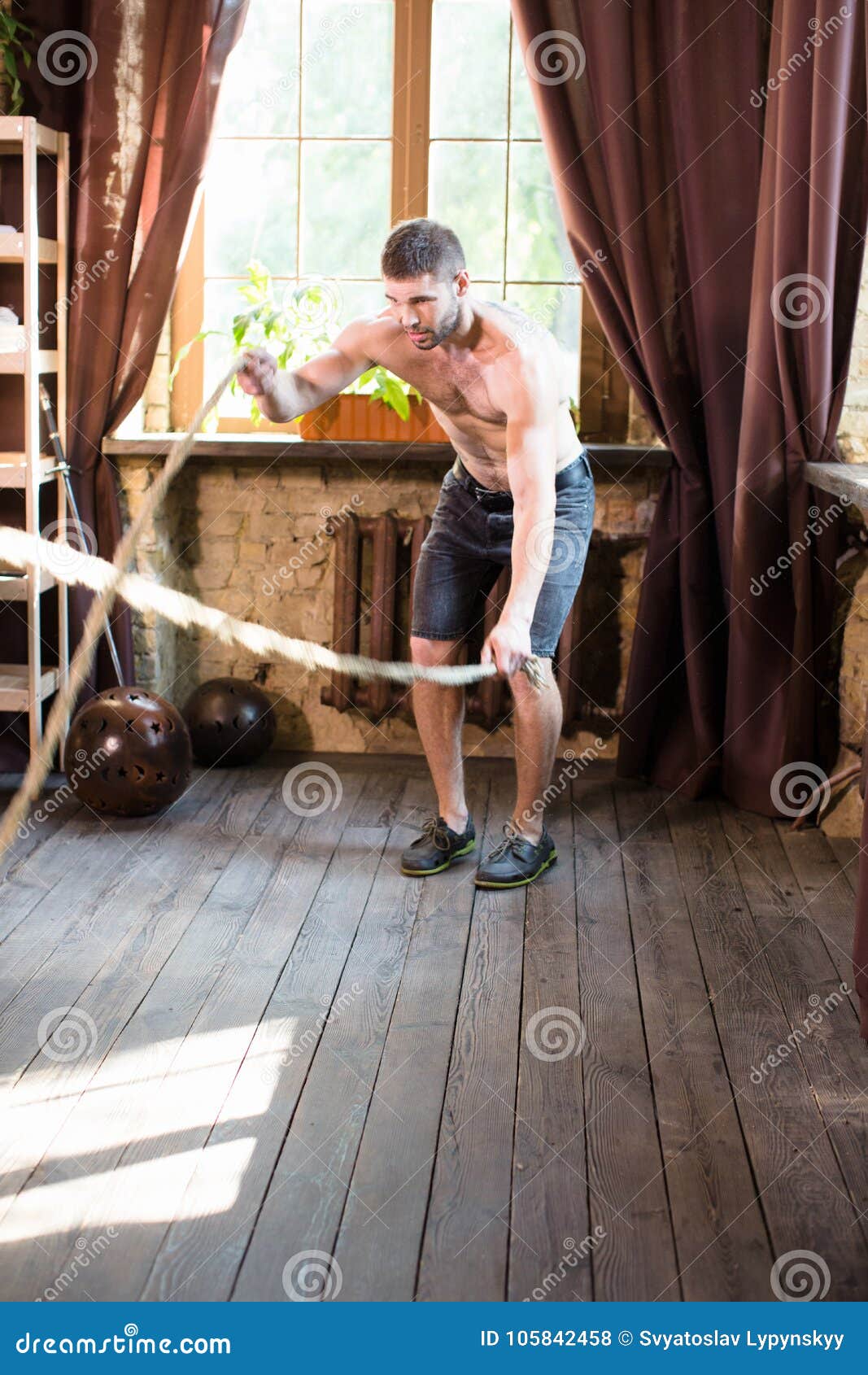 Man Working Out with Training Ropes at Home. Stock Photo - Image of ...