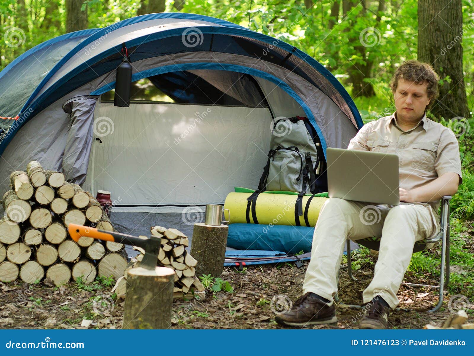 Man Working Outdoors in a Tent Camp. Stock Image - Image of exterior ...