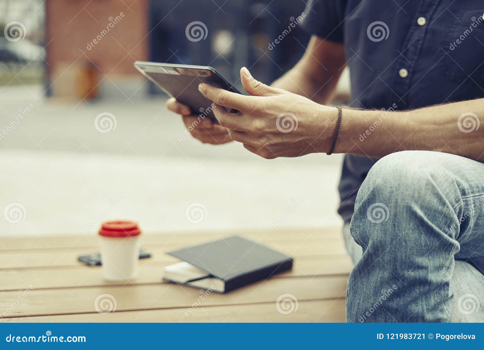 Man Working Outside in Park Using Modern Tablet, Notebook, Mobile Phone ...