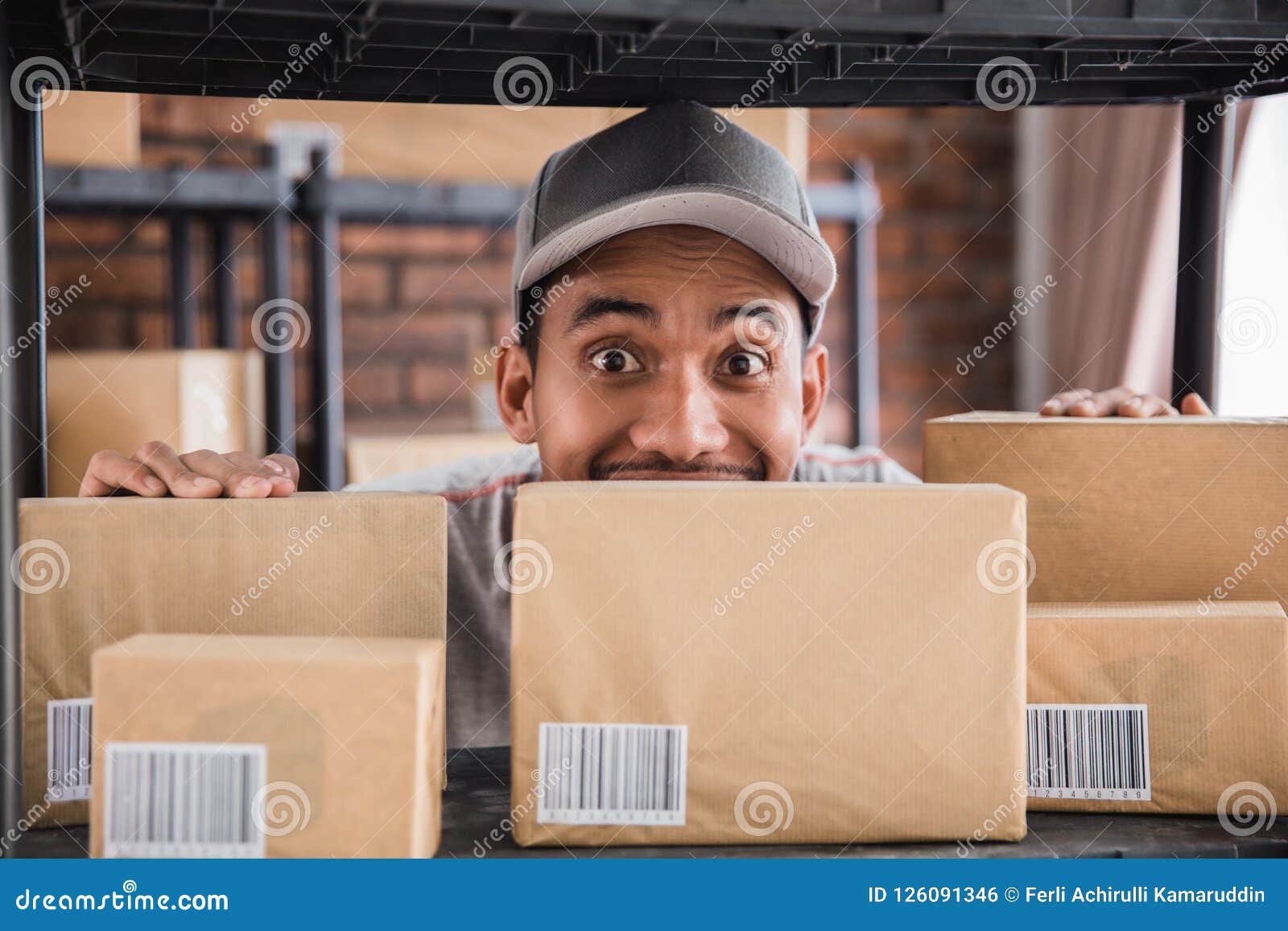 Man Working in Packages Shelf Stock Photo - Image of standing ...
