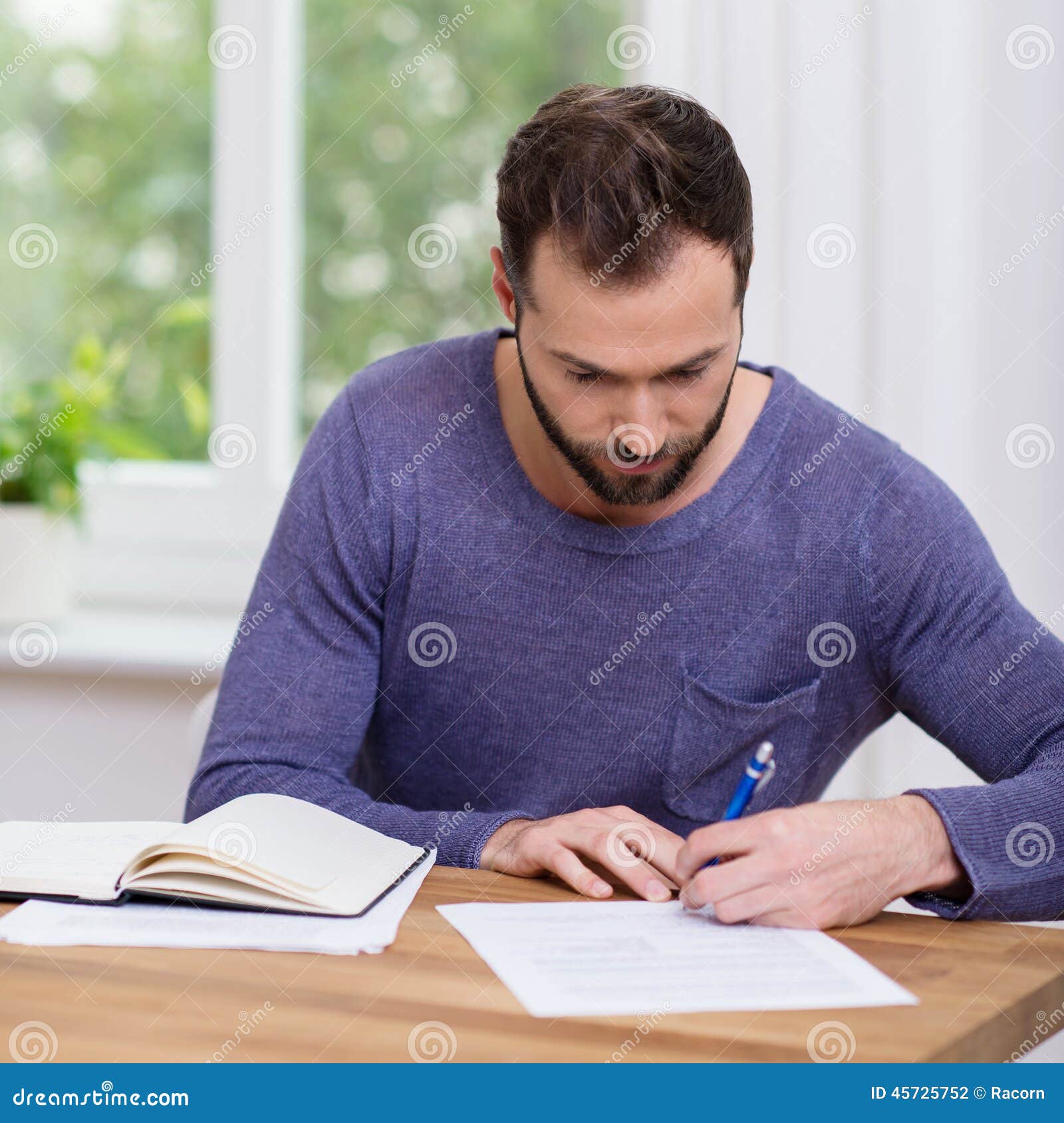 Man Working on Paperwork at Home Stock Photo - Image of information ...