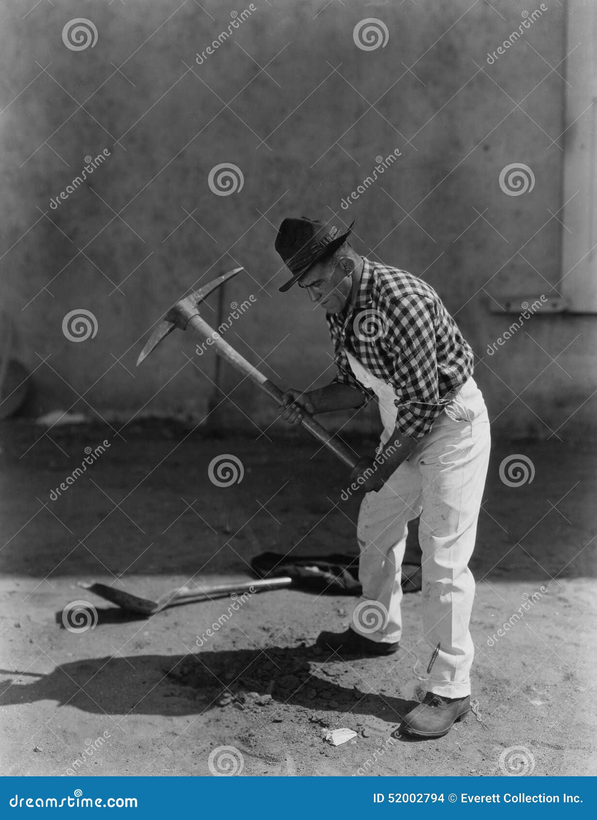 Man working with pick axe stock photo. Image of employees - 52002794