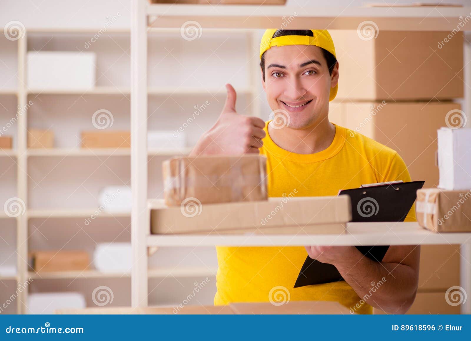 The Man Working in Postal Parcel Delivery Service Office Stock Photo ...