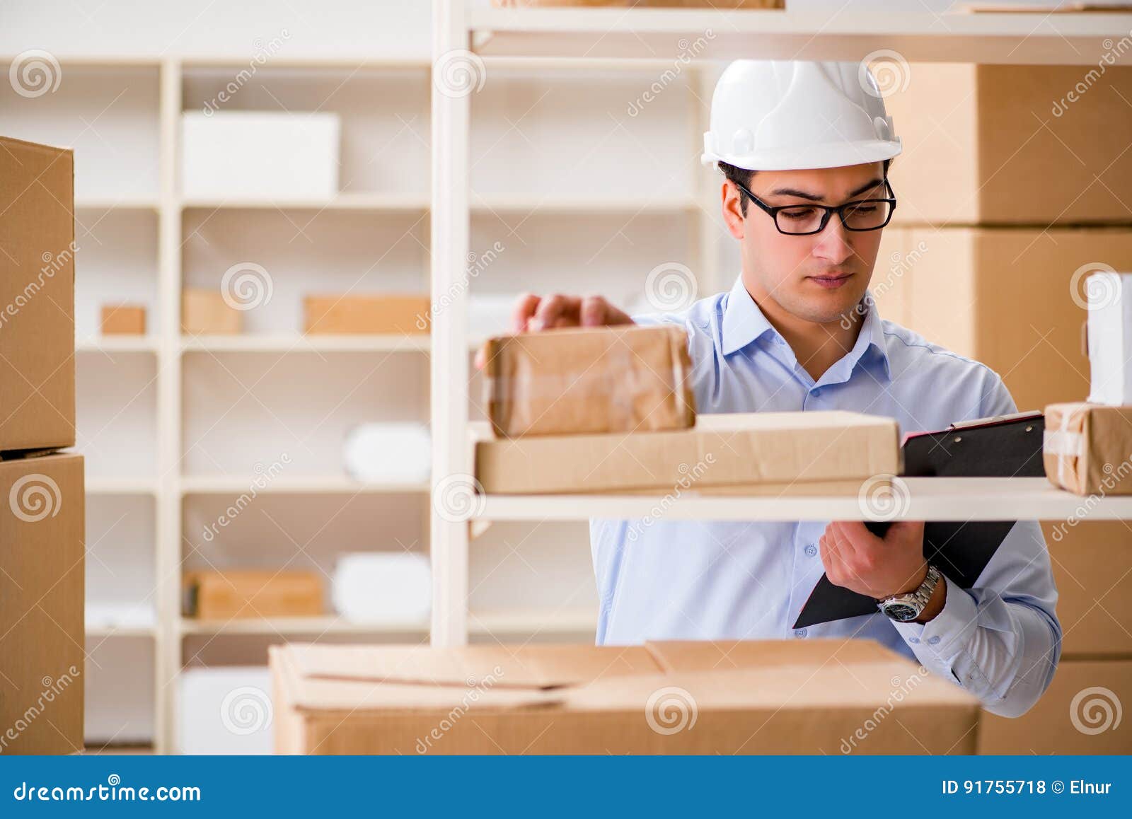 The Man Working in Postal Parcel Delivery Service Office Stock Photo ...