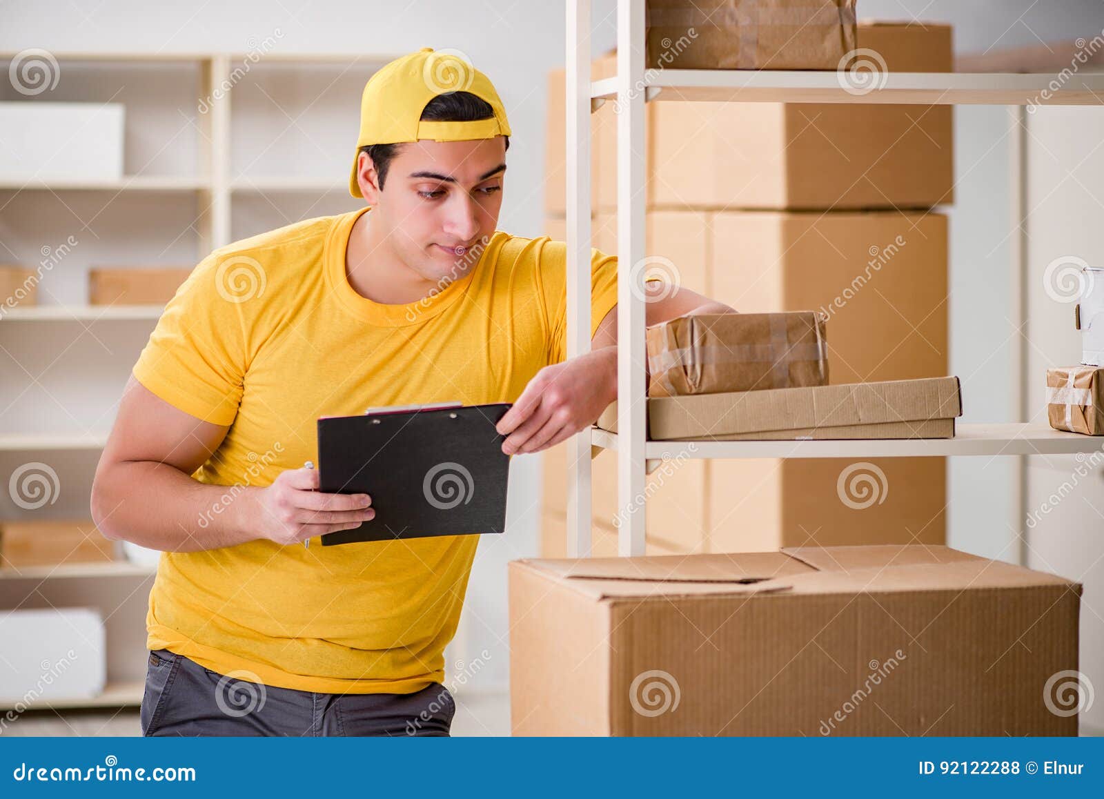 The Man Working in Postal Parcel Delivery Service Office Stock Photo ...