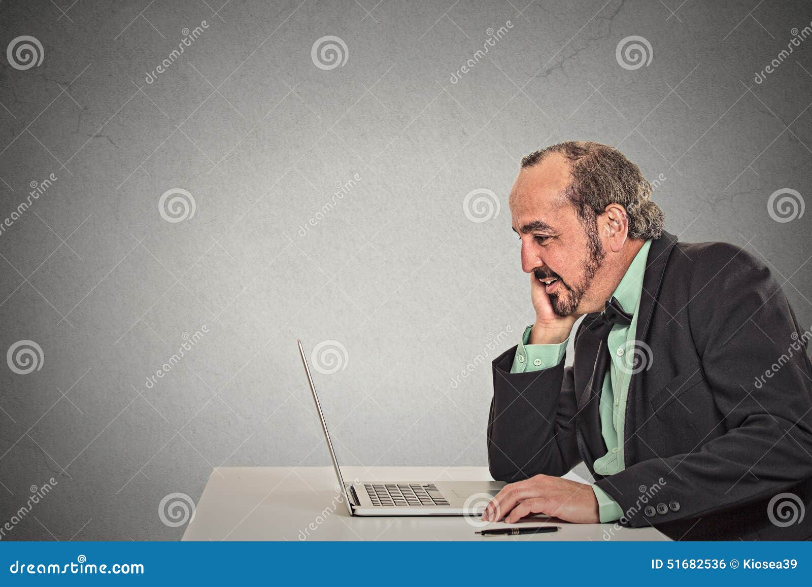 Man Working Reading Something on His Laptop Computer Stock Photo ...