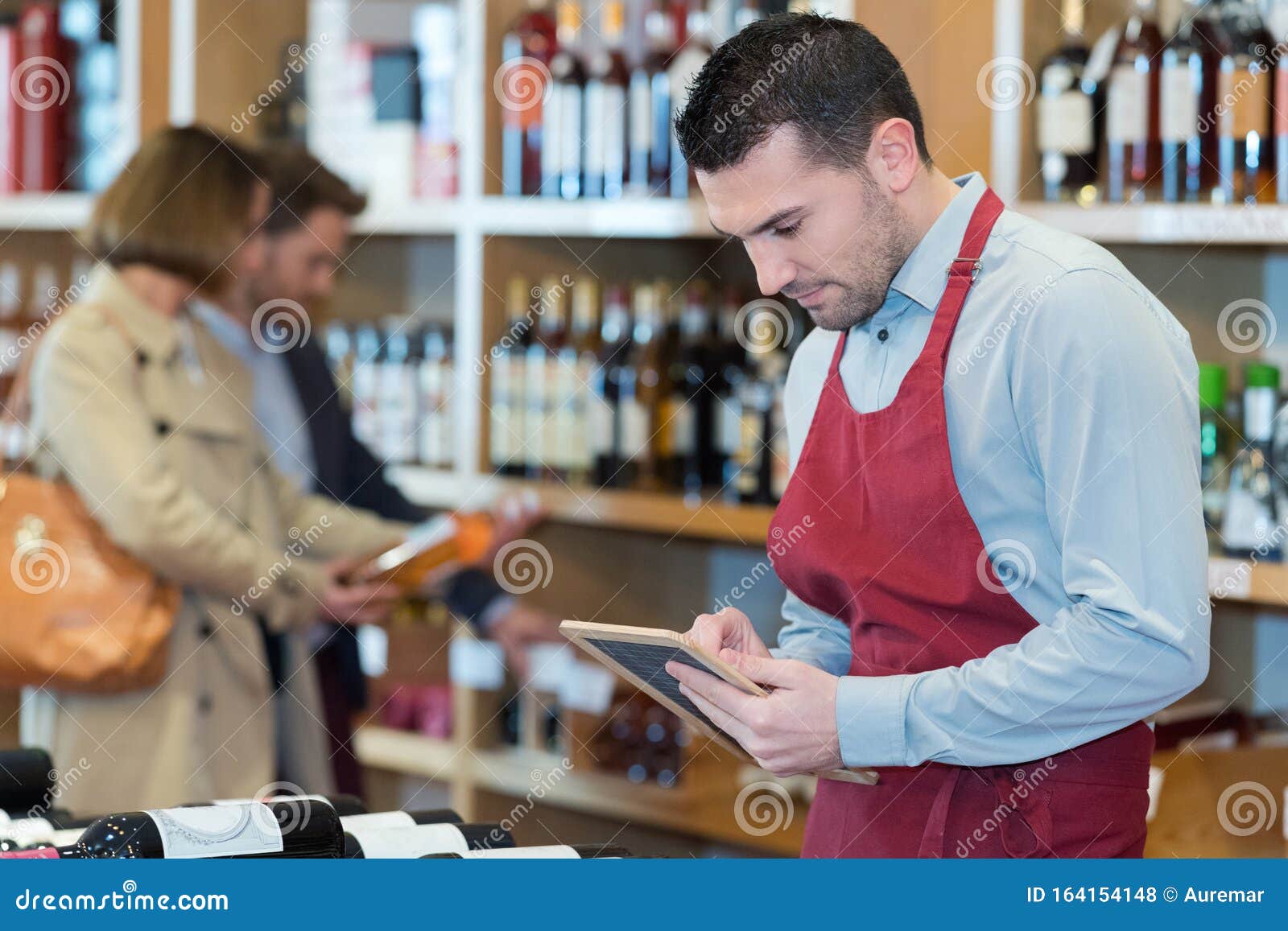 Man working in restaurant stock photo. Image of professional - 164154148