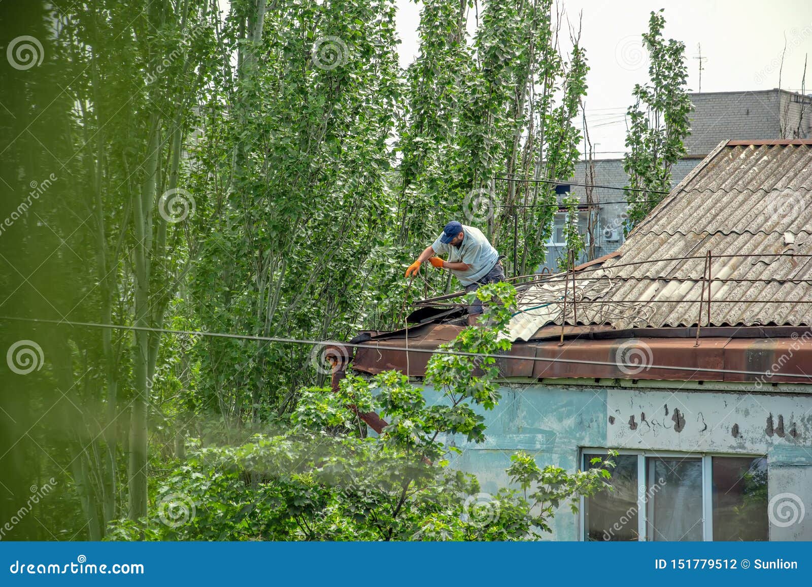 Man Working on the Roof of a Residental Building Editorial Photography ...