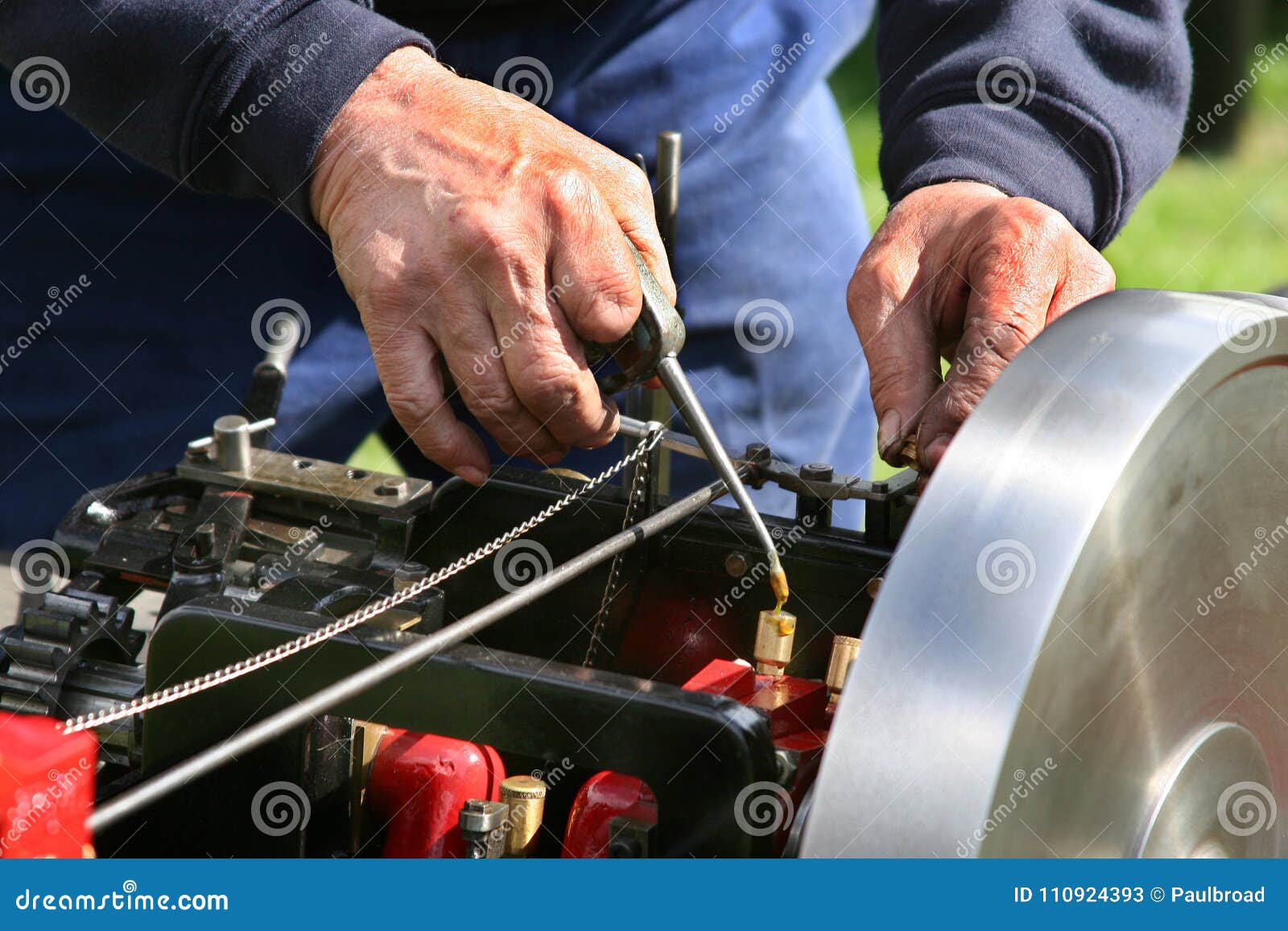 Man Working on Scale Model Steam Powered Traction Engine. Stock Image ...