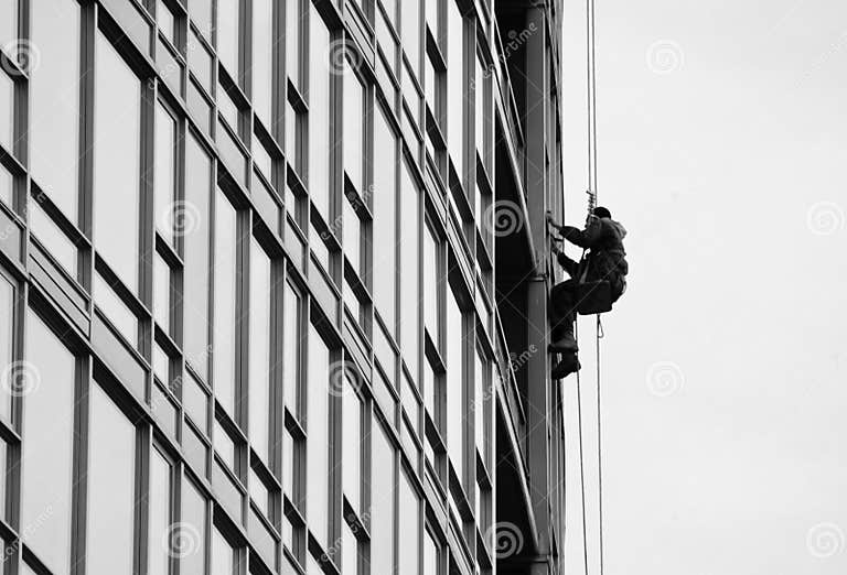 Man Working on Skyscraper stock photo. Image of downtown - 7098094