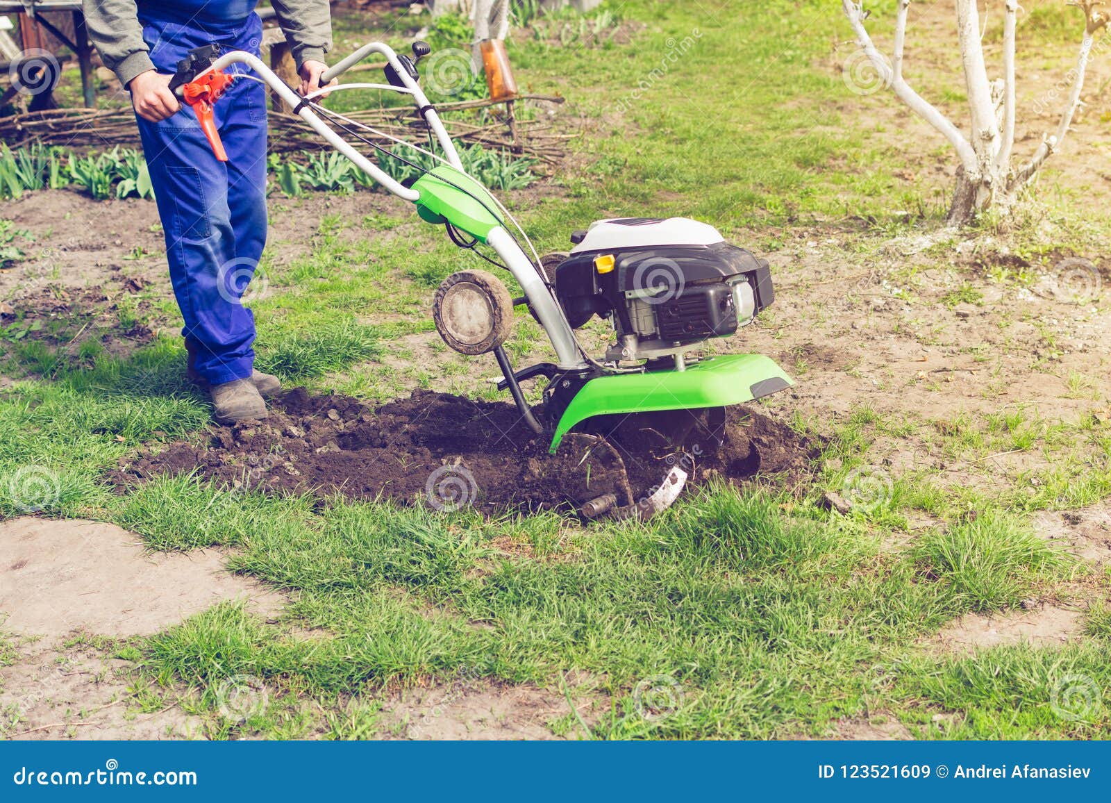 Man Working in the Spring Garden with Tiller Machine Stock Image ...