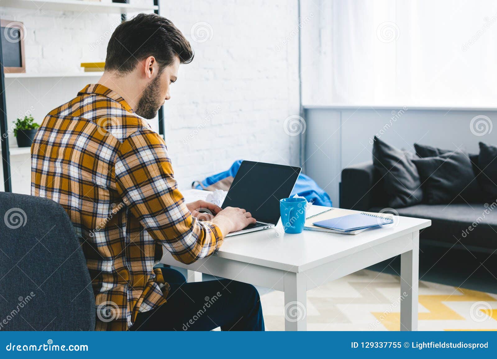 Man Working by Table with Laptop Stock Image - Image of documents ...