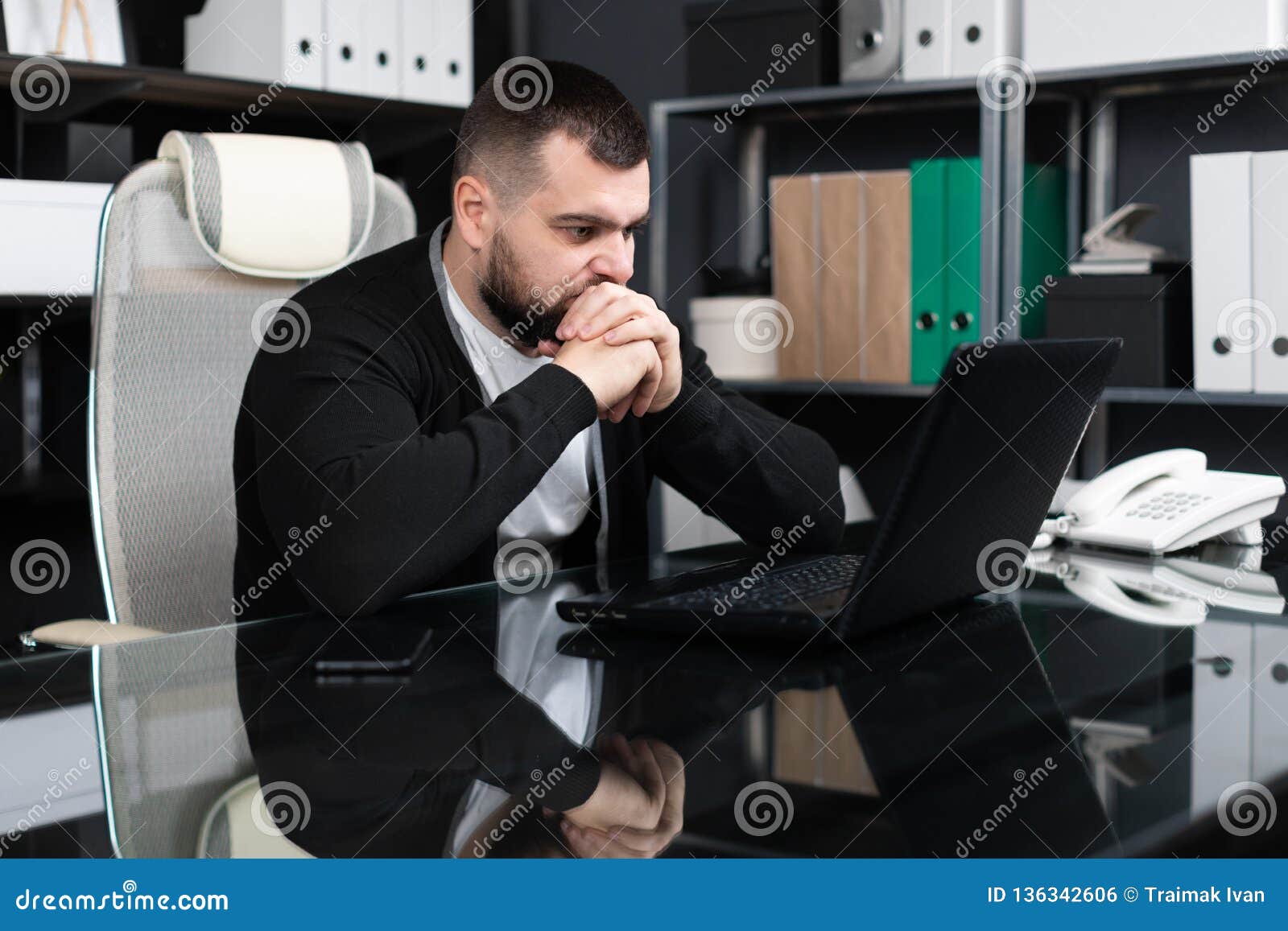 Portrait of Young Man Sitting at Table in Office Stock Photo - Image of ...