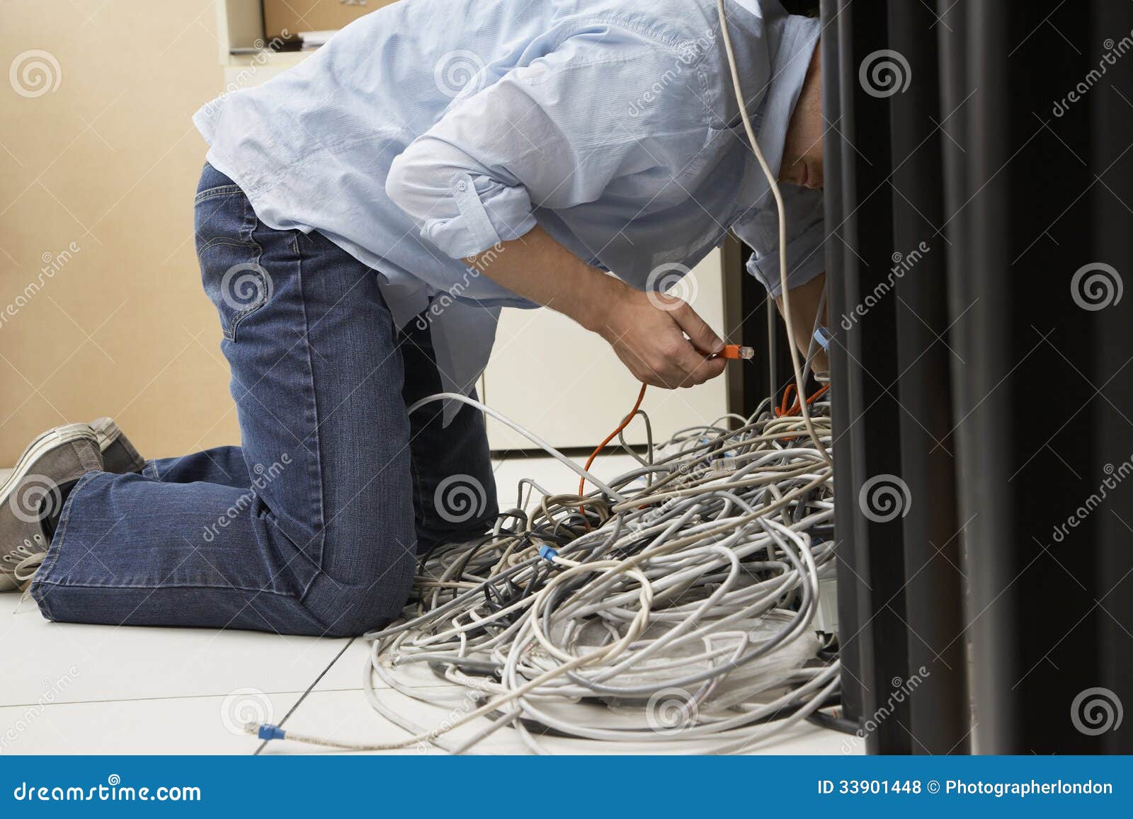 Man Working on Tangled Computer Wires Stock Photo - Image of caucasian ...