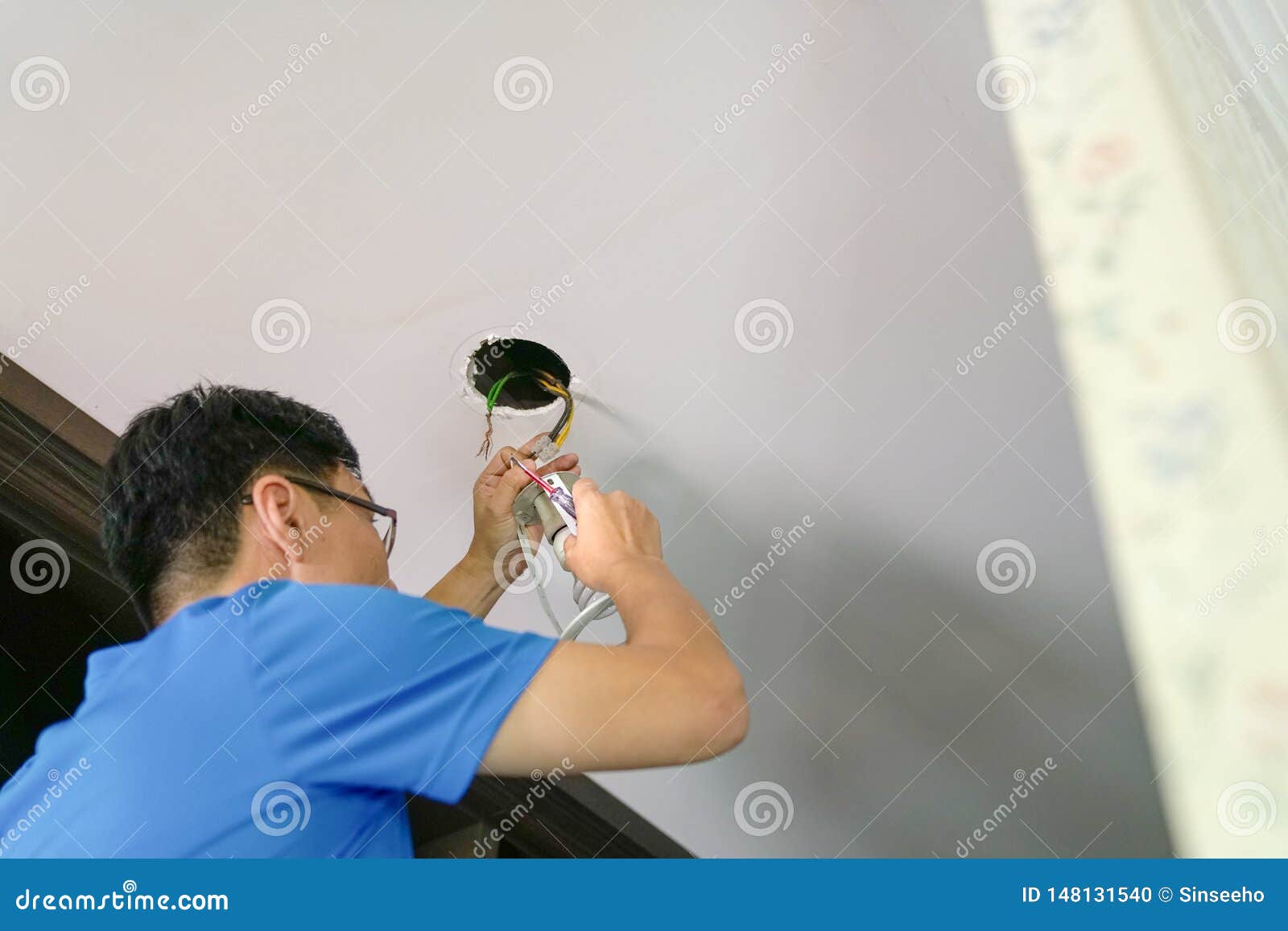 Man Working To Change a Light Bulb Stock Photo - Image of engineer ...