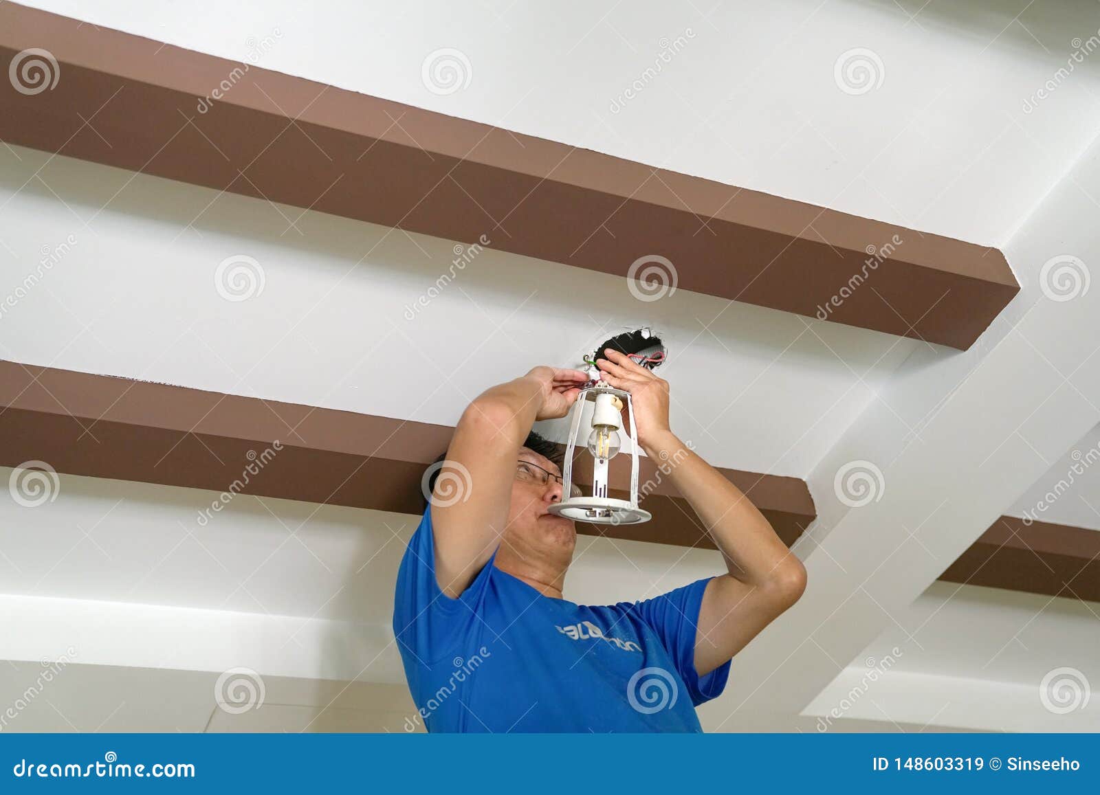 Man Working To Change a Light Bulb Stock Image - Image of equipment ...
