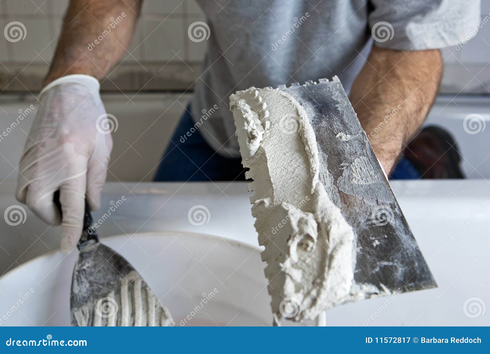 Man Working with Trowel and Mortar Tiling a Wall Stock Image - Image of ...
