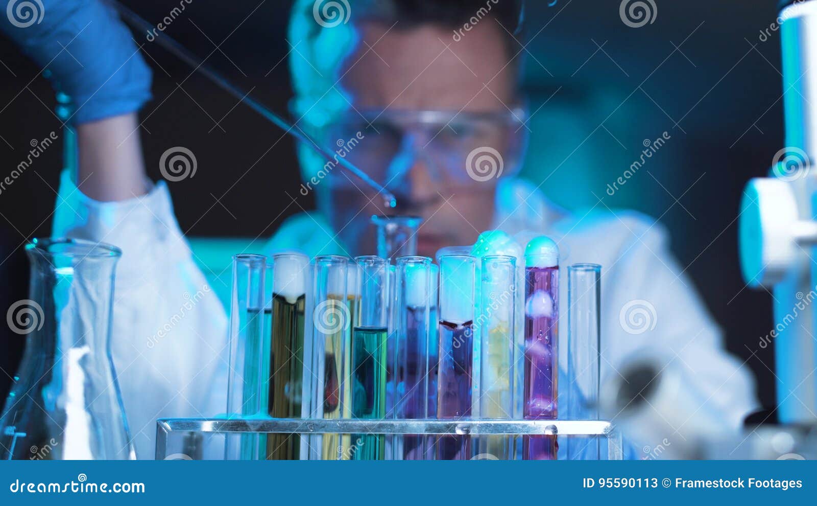 Man working with tubes stock image. Image of researcher - 95590113