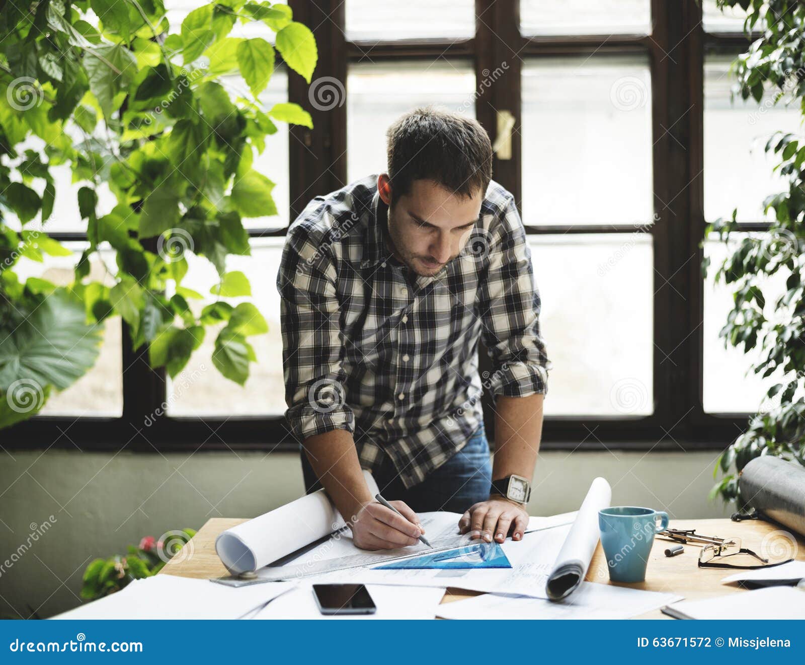 Man working stock photo. Image of coffee, blueprint, design - 63671572