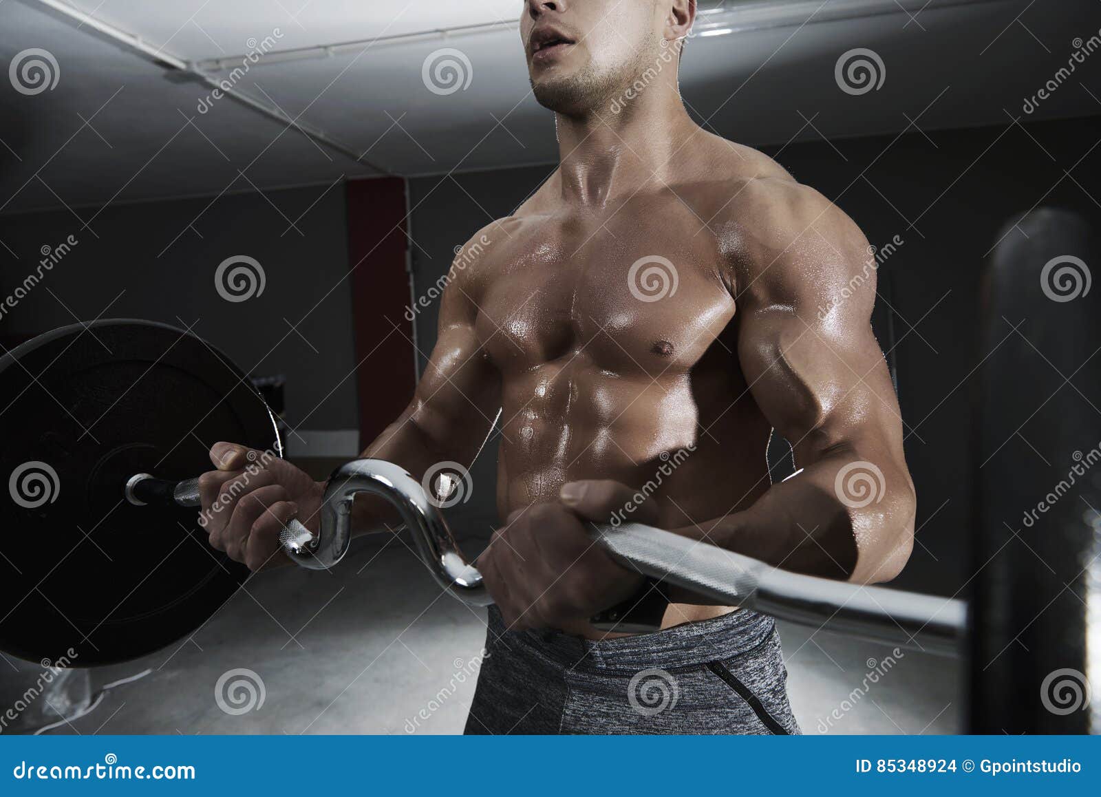 Man during the workout stock photo. Image of body, illuminated - 85348924