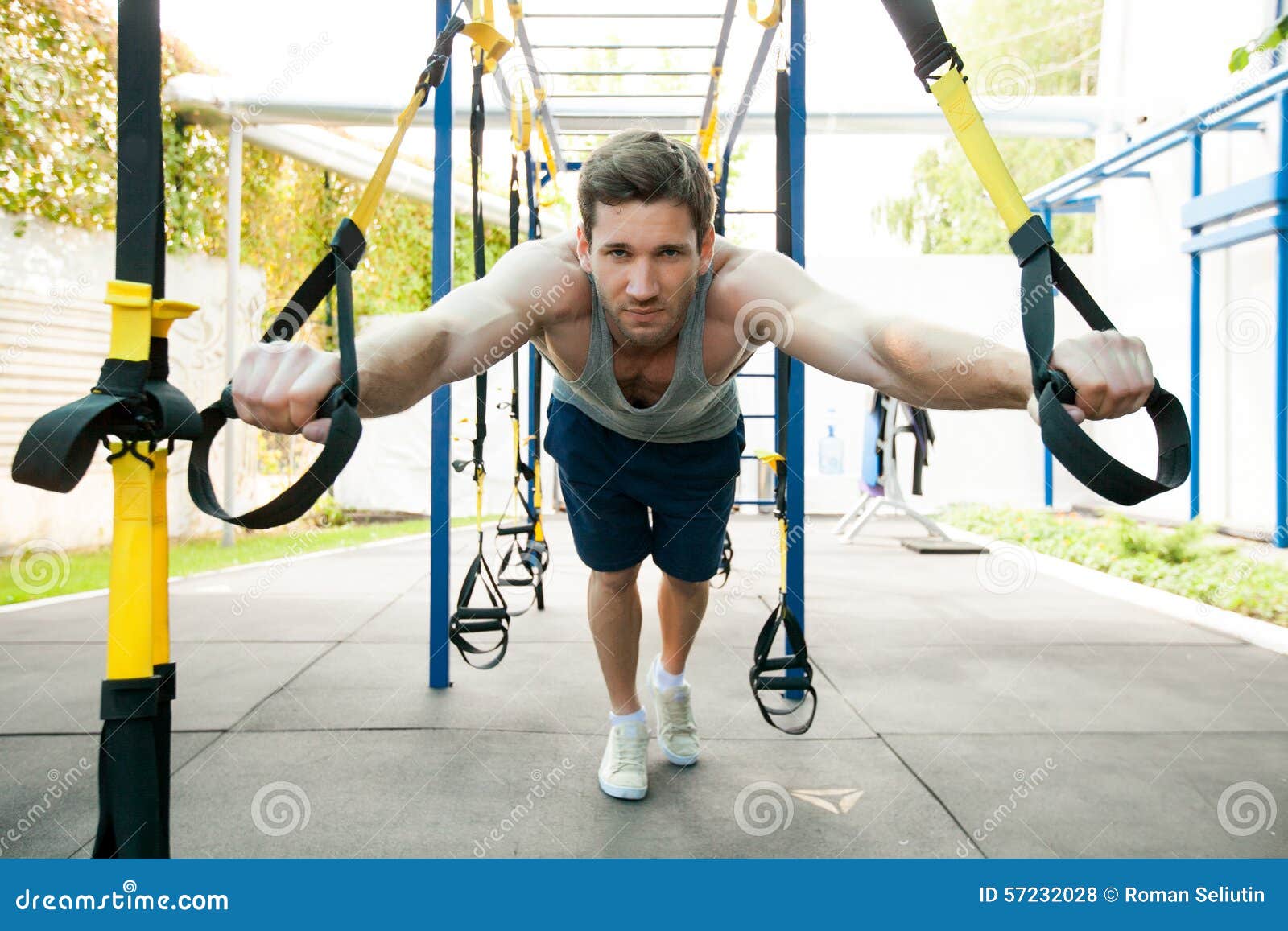 Man during Workout with Suspension Straps on the Street Stock Photo ...